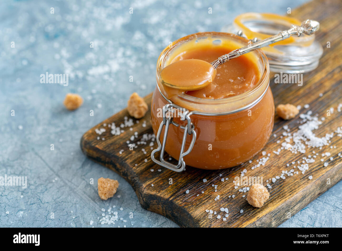Glass jar with homemade salted caramel Stock Photo - Alamy