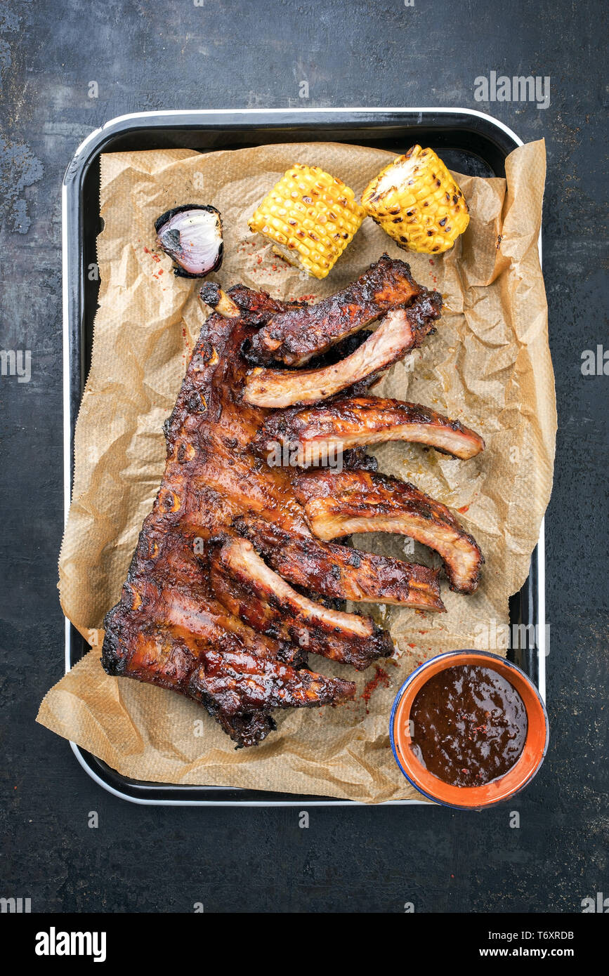 Barbecue spare ribs St Louis cut with hot honey chili marinade and corn ...