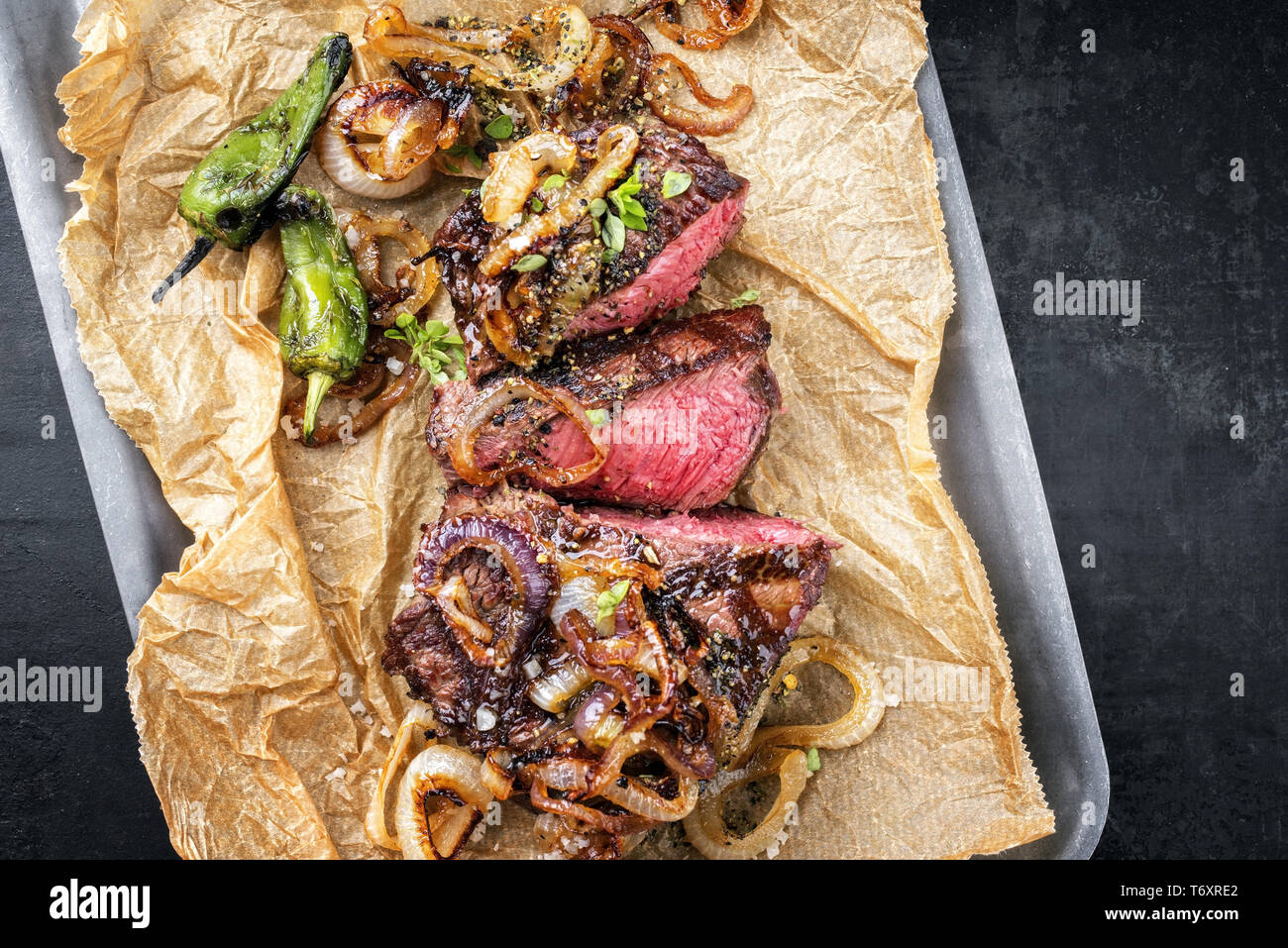 Traditional German barbecue sliced zwiebelrostbraten with fried onion ...