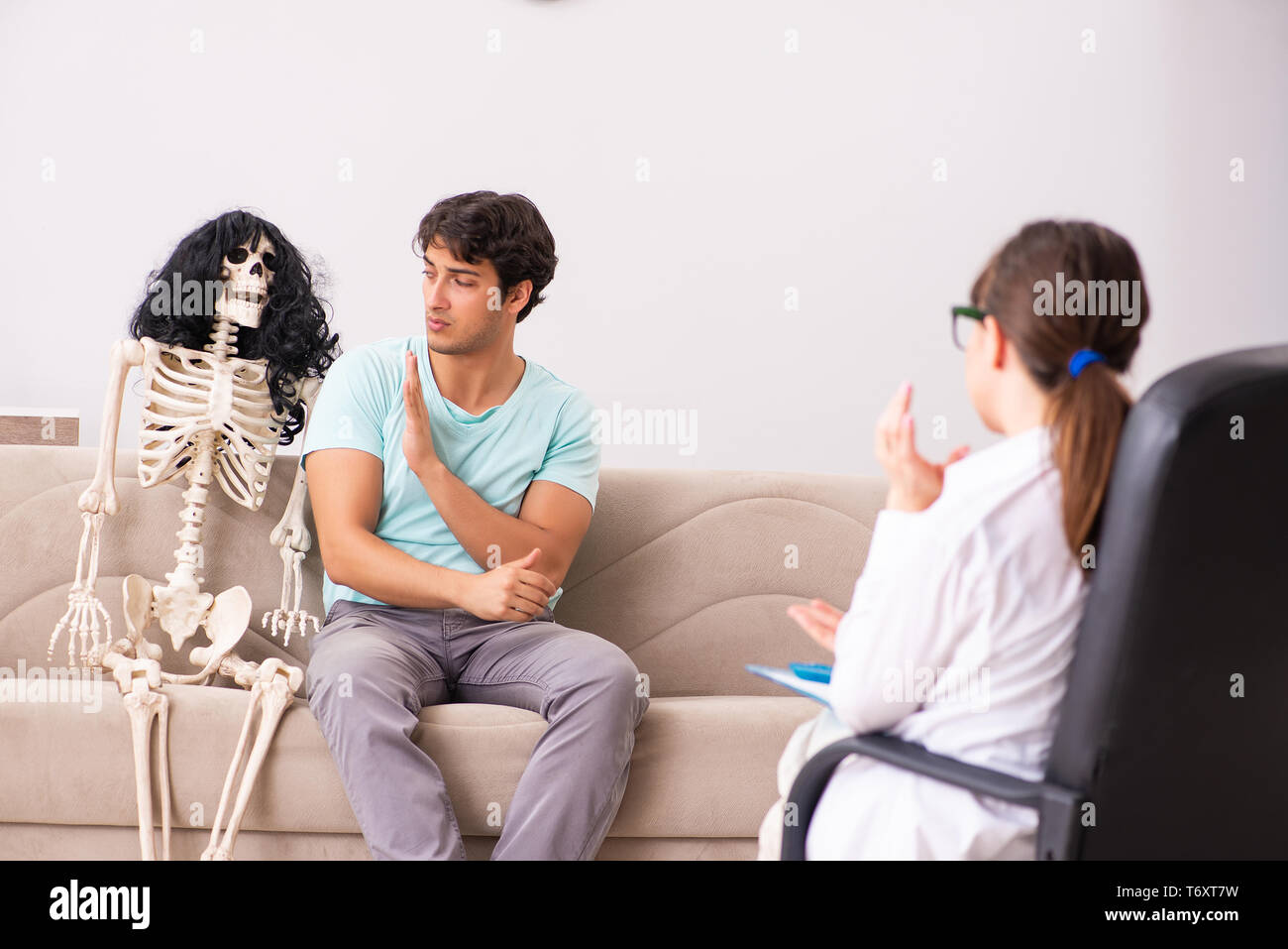 Young patient visiting psychologist for therapy Stock Photo - Alamy