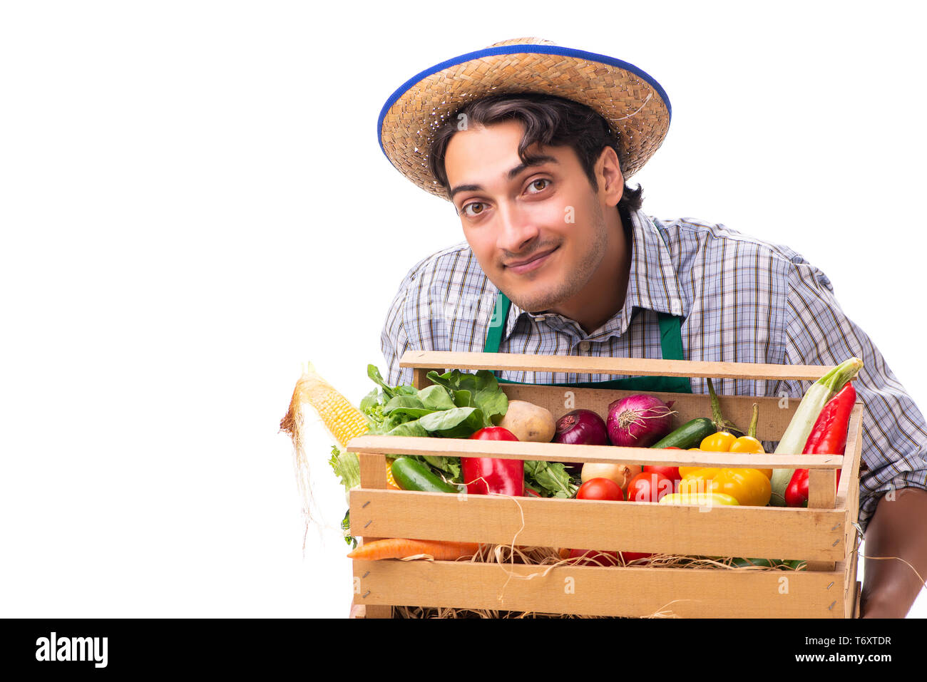 Young farmer with fresh produce isolated on white background Stock ...
