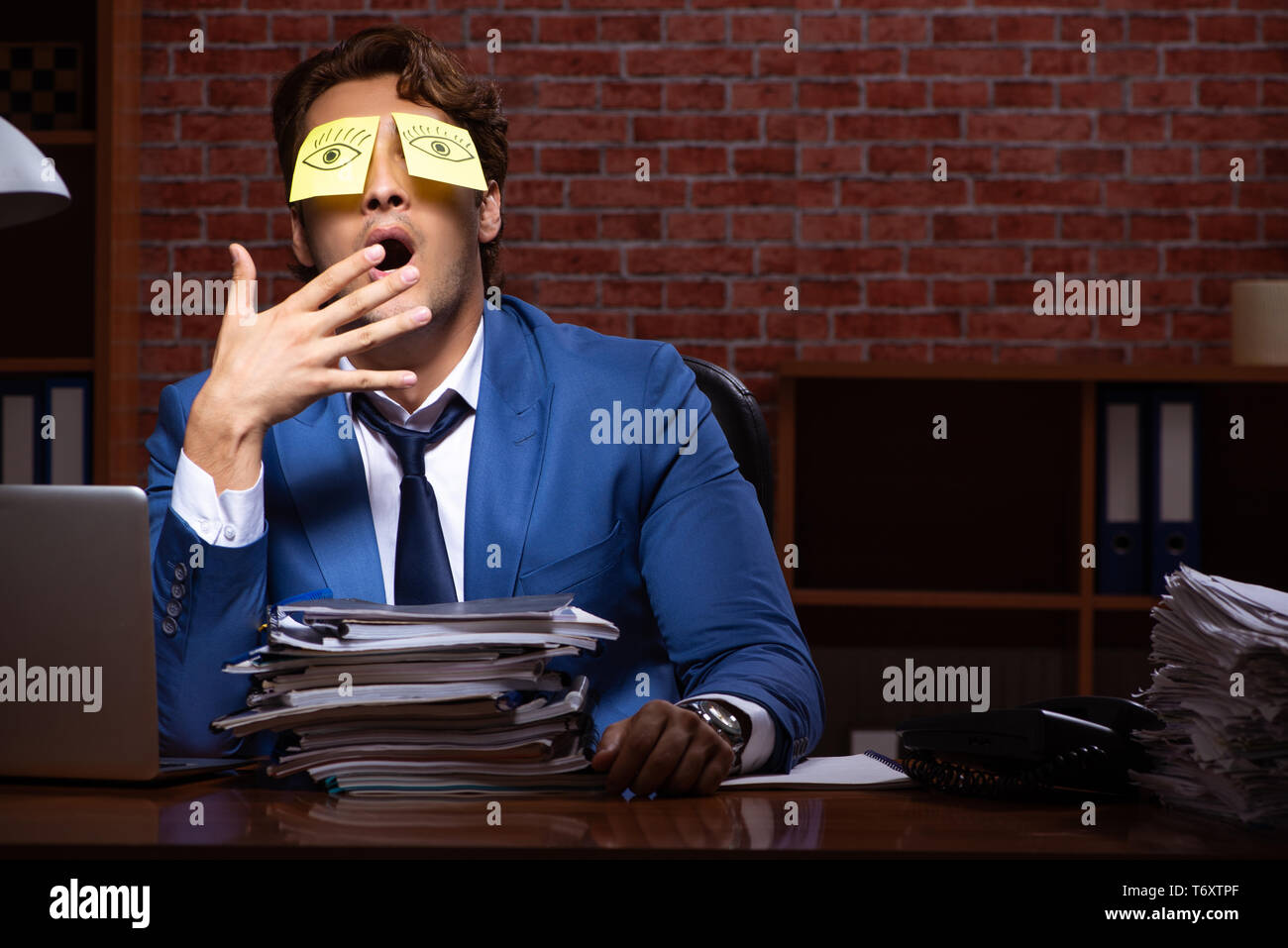 Young businessman working in the office at night Stock Photo - Alamy