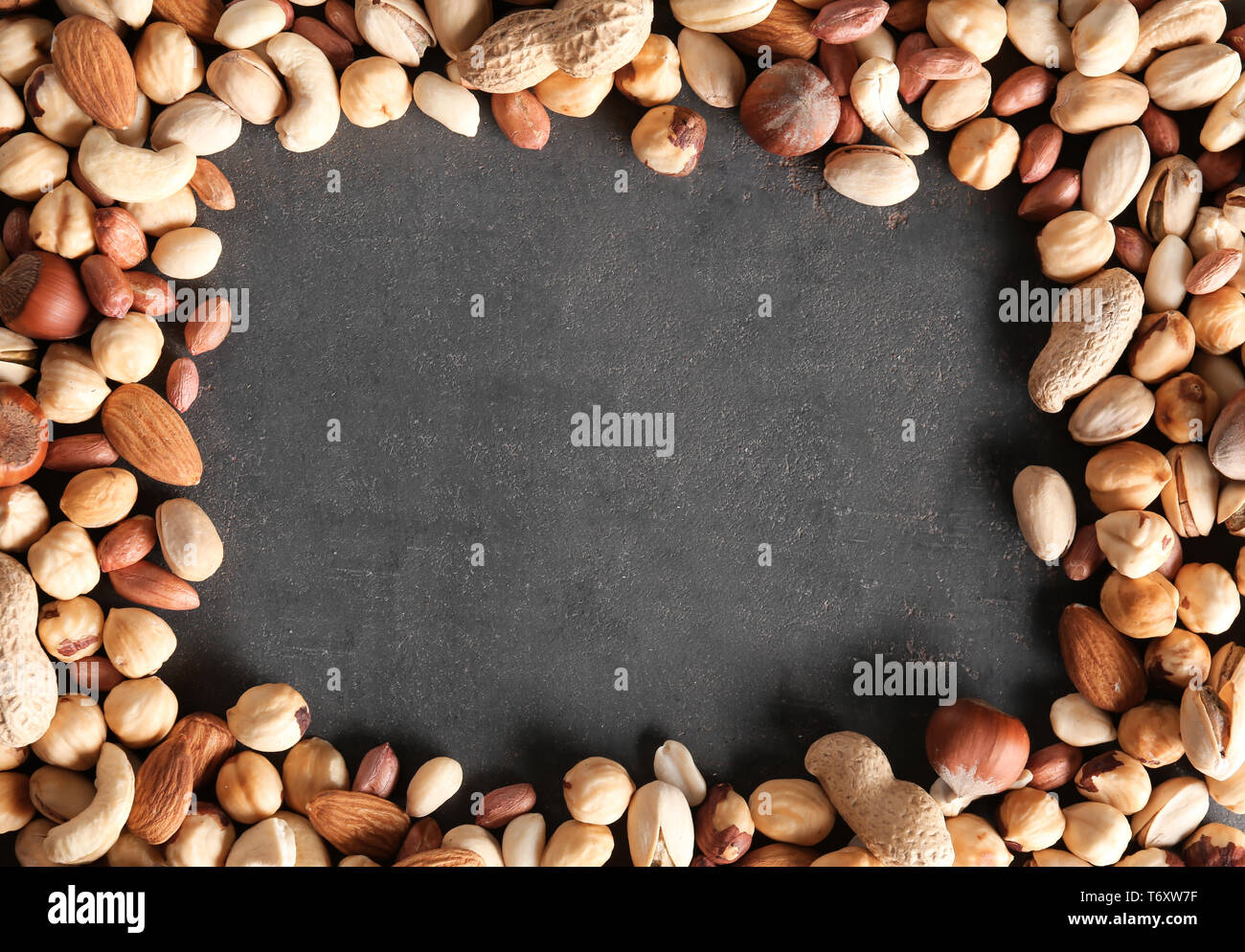 Frame made of different nuts on grey background Stock Photo - Alamy