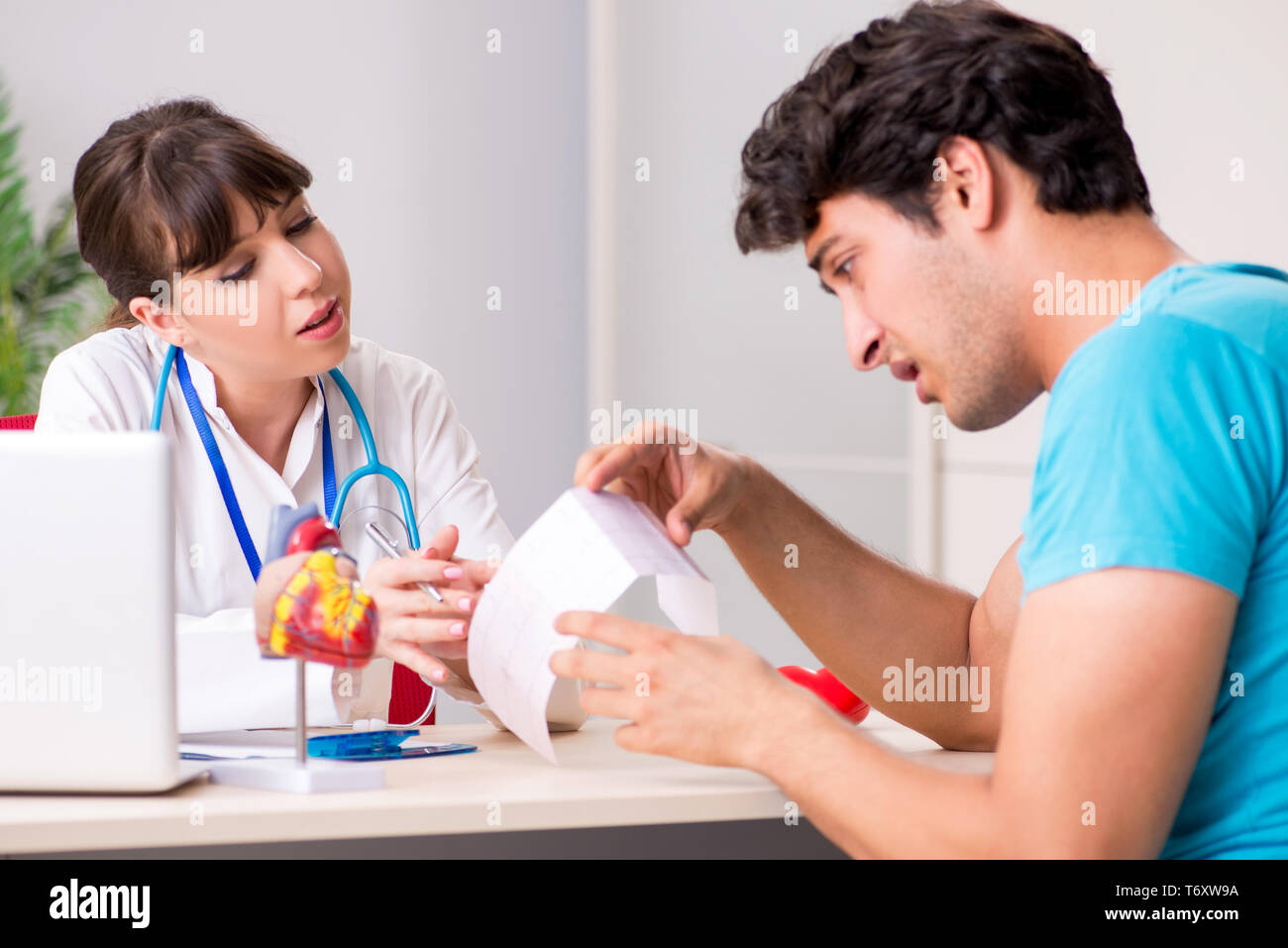 Young patient visiting doctor cardiologist Stock Photo - Alamy