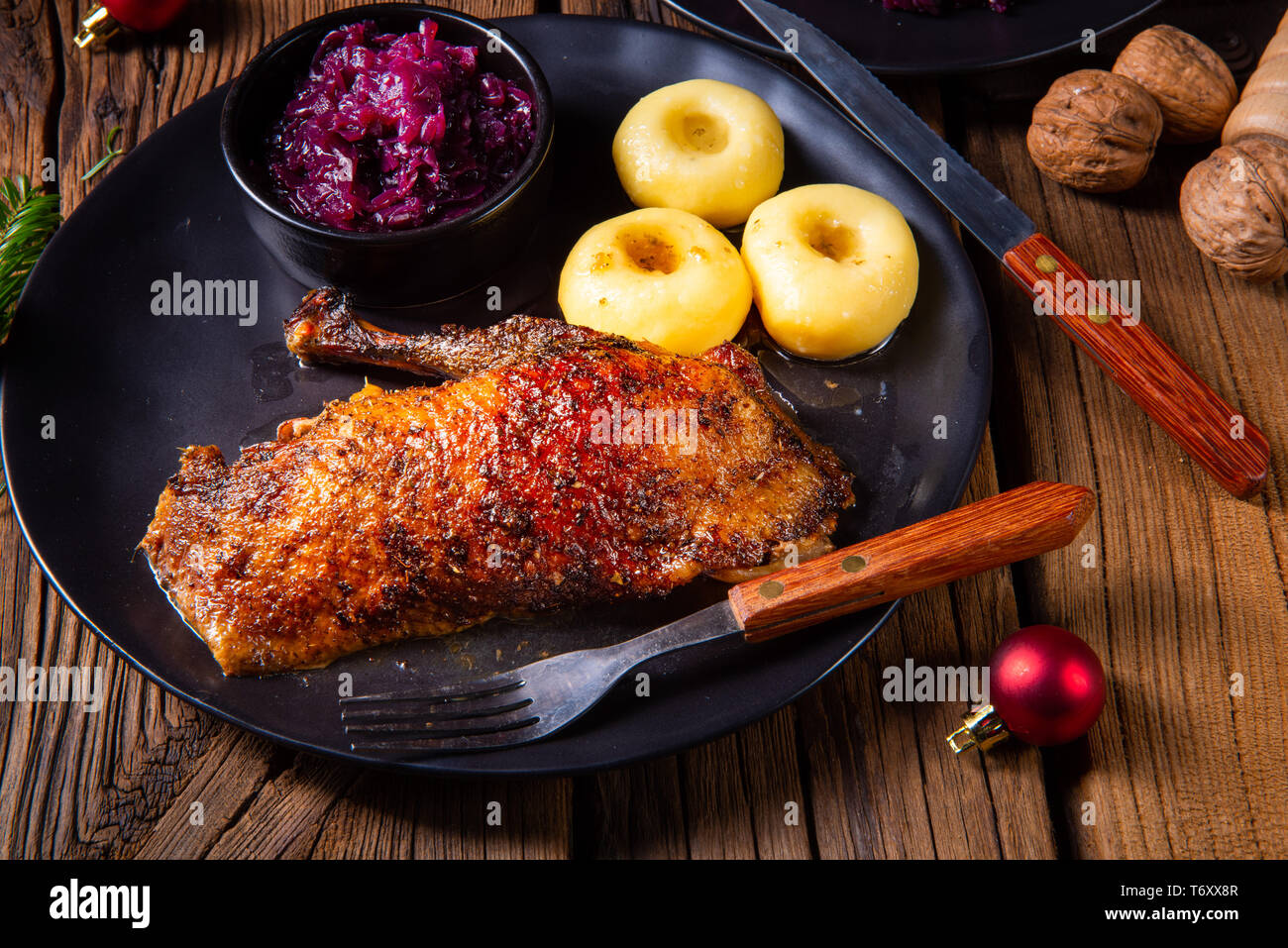 classic and crispy roasted duck with cabbage and dumplings Stock Photo ...