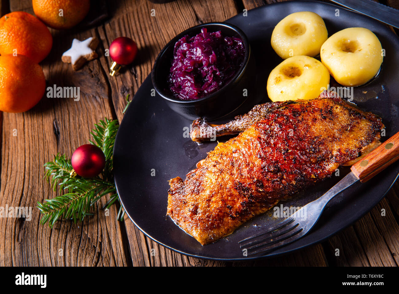 classic and crispy roasted duck with cabbage and dumplings Stock Photo ...