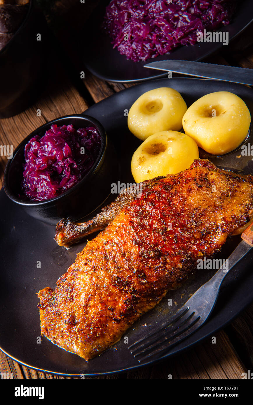 classic and crispy roasted duck with cabbage and dumplings Stock Photo ...