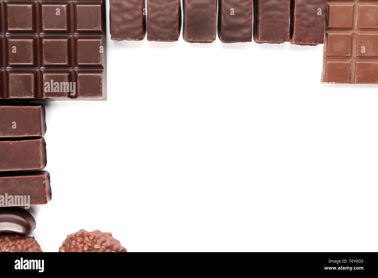 Chocolate bars with candies on white background Stock Photo - Alamy