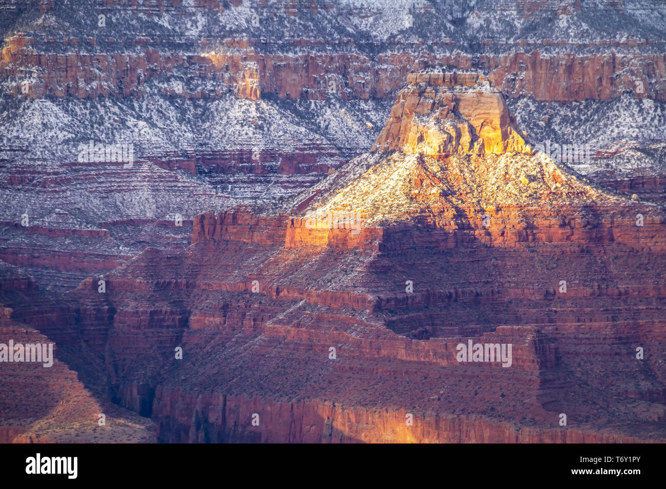 The colors of the many layers of the rock that forms the walls of the ...