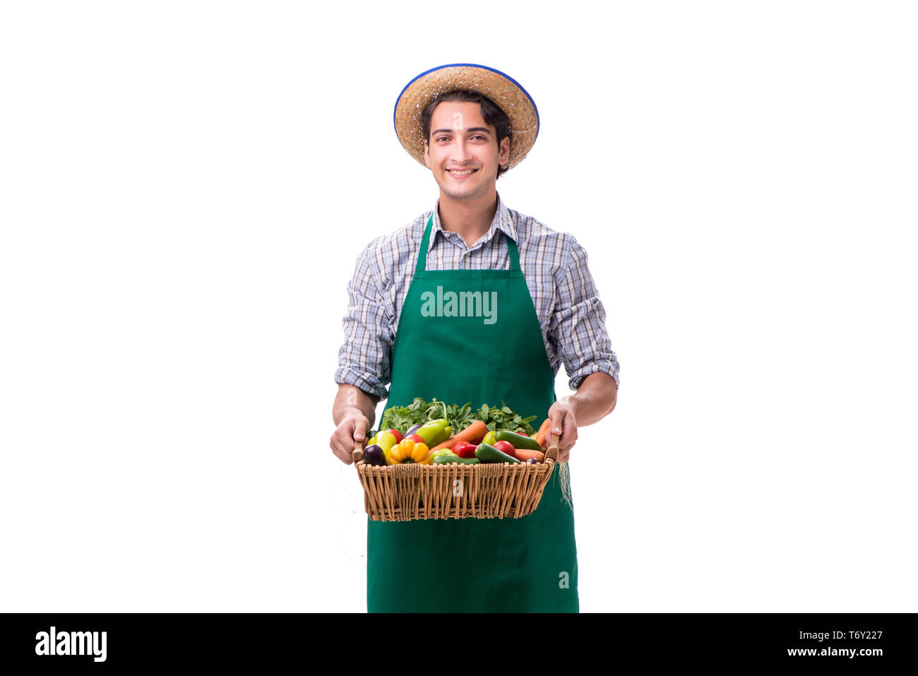 The young farmer with fresh produce isolated on white background Stock ...
