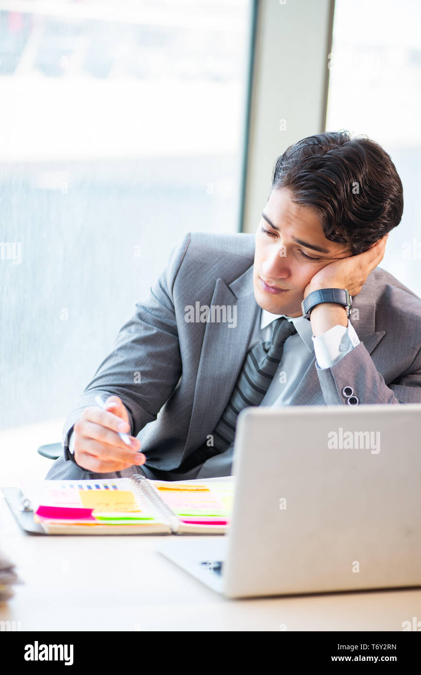 The young successful businessman working at the office Stock Photo - Alamy