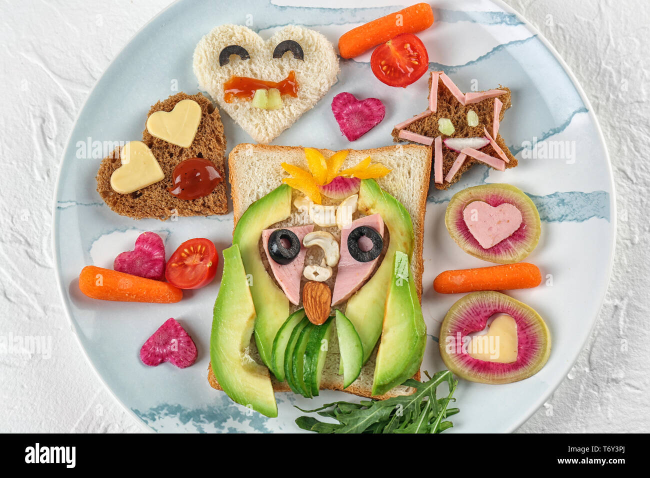 Creative breakfast for children on plate. Recipe ideas with bread Stock ...