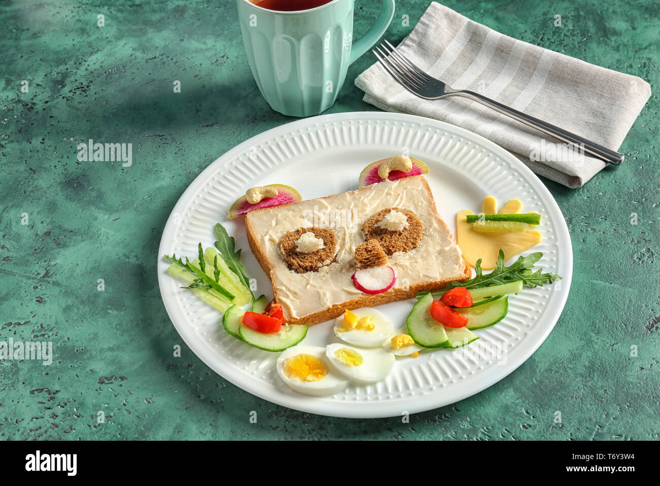 Creative breakfast for children on plate. Recipe ideas with bread Stock ...