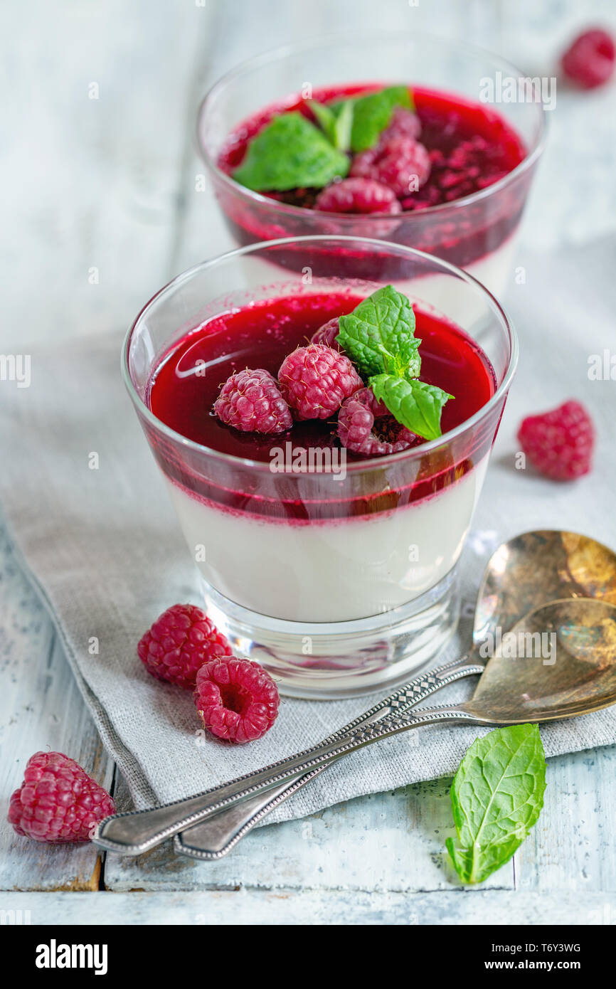 Vanilla Panna cotta with raspberry sauce and mint Stock Photo - Alamy