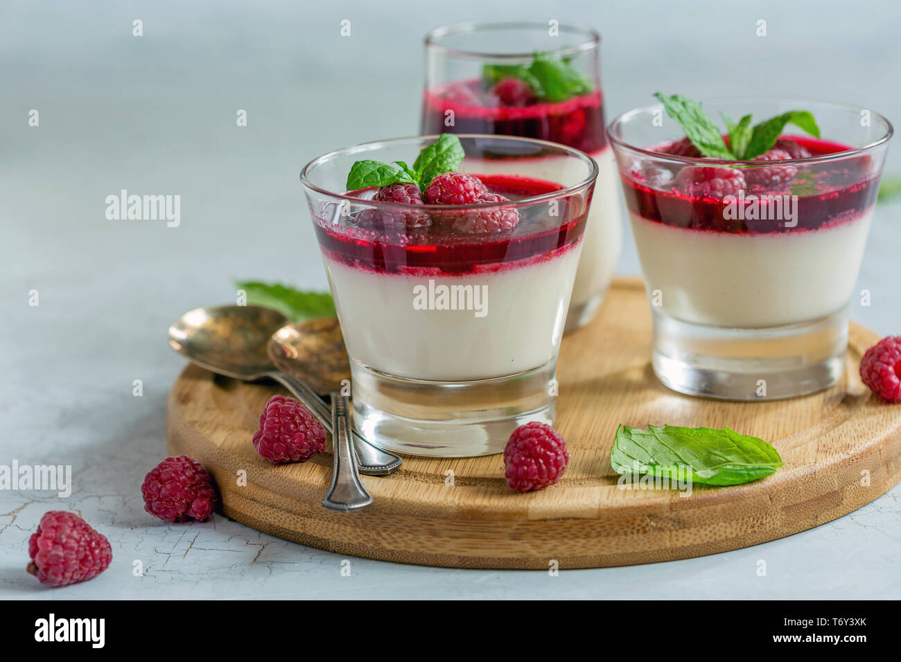 Vanilla Panna cotta with raspberry and mint Stock Photo - Alamy