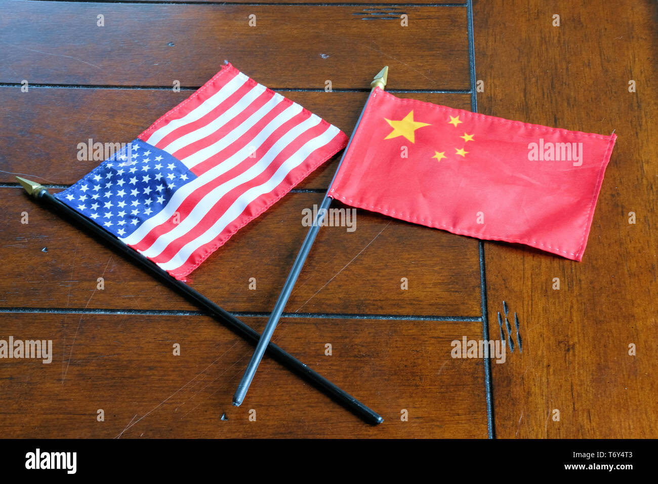 Flags of the United States and China on a wooden surface; Chinese ...