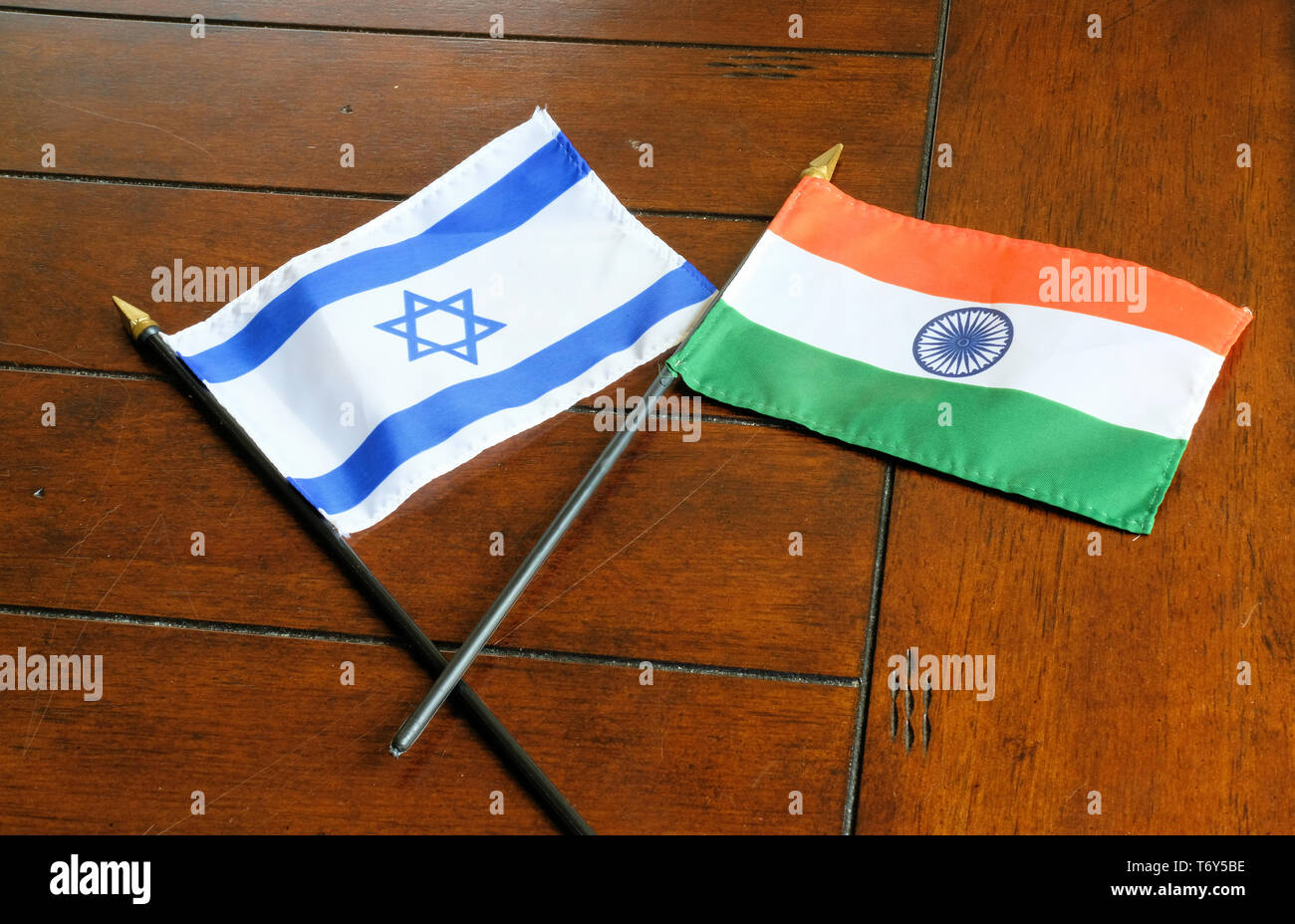 Flags of India and Israel on a wooden surface; Indian-Israeli relations ...