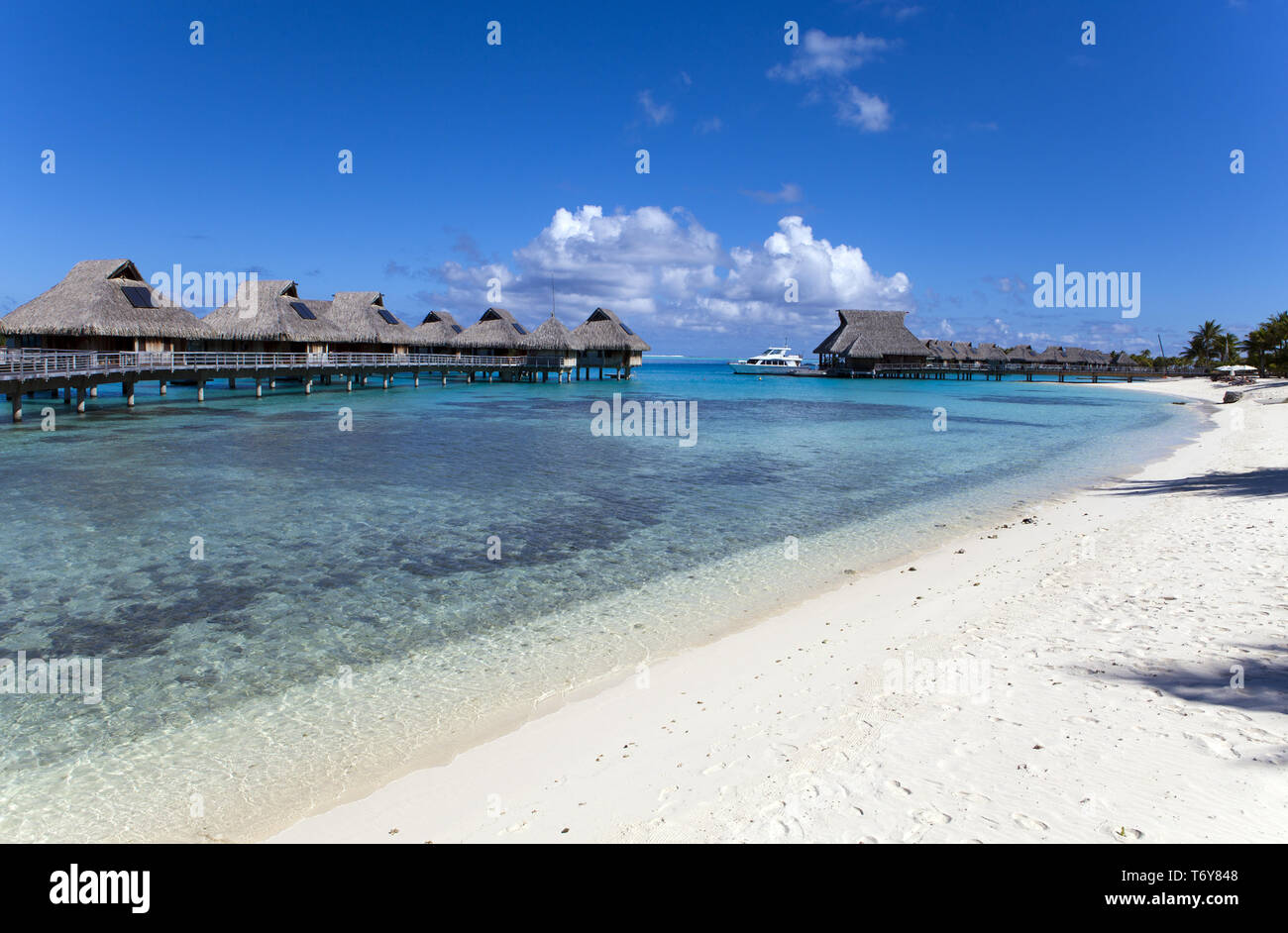 Typical Polynesian landscape -small houses on water Stock Photo - Alamy