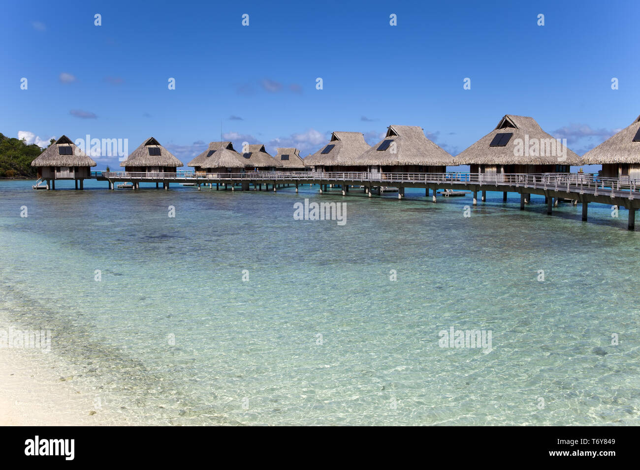 Typical Polynesian landscape -small houses on water Stock Photo - Alamy