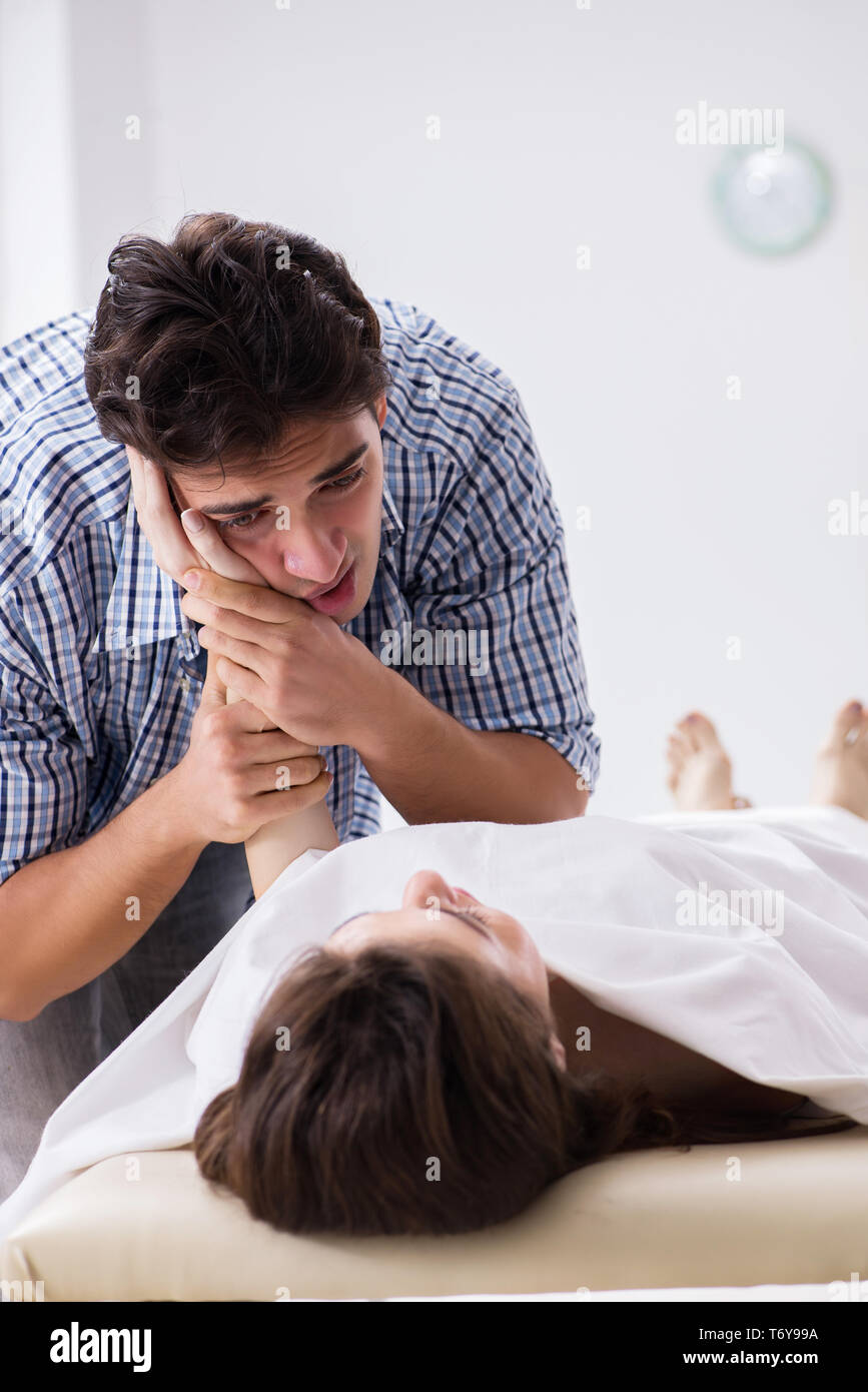 Man mourning his dead wife Stock Photo - Alamy