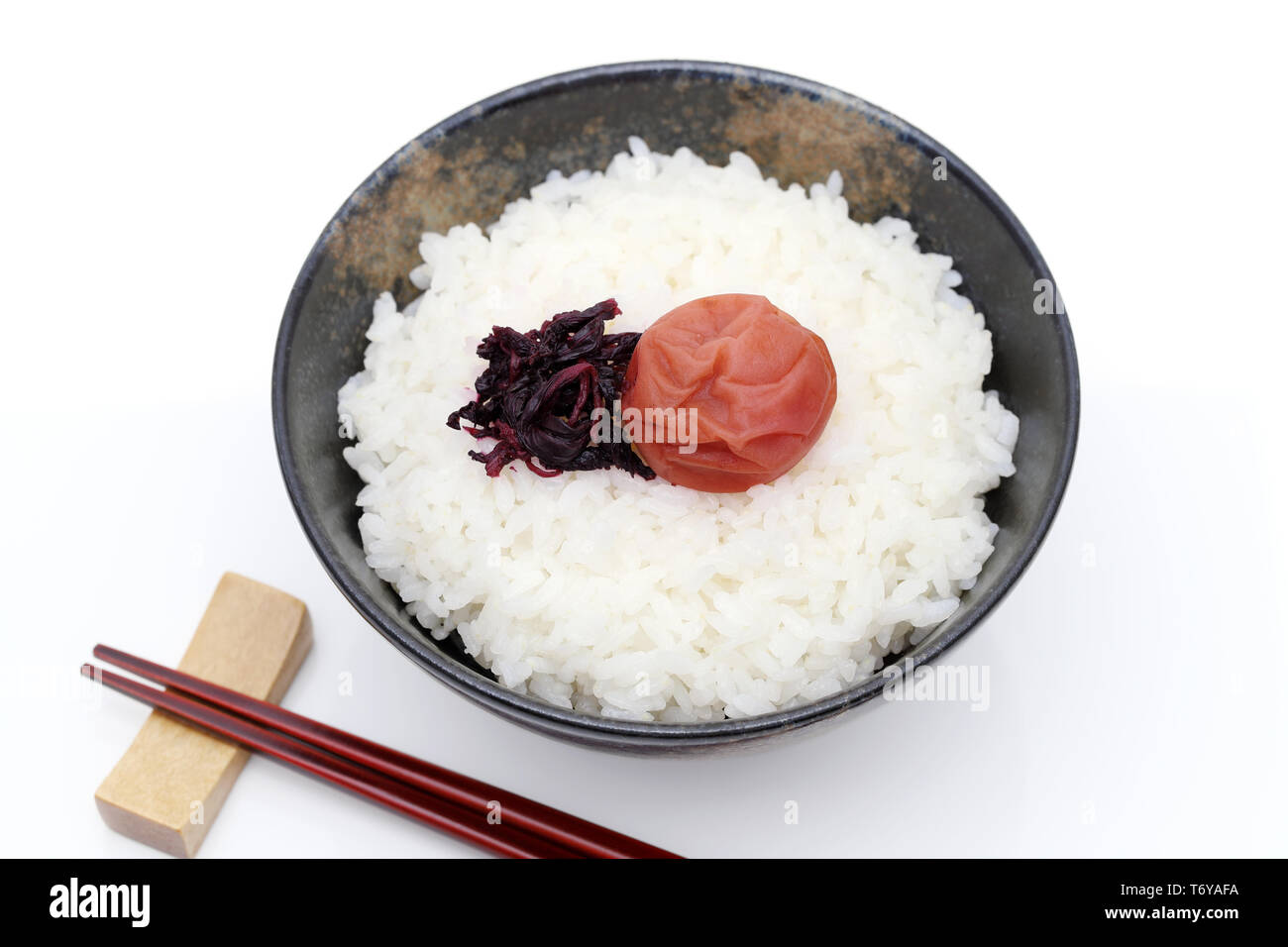 Japanese cooked white rice with salt plum on white background Stock ...