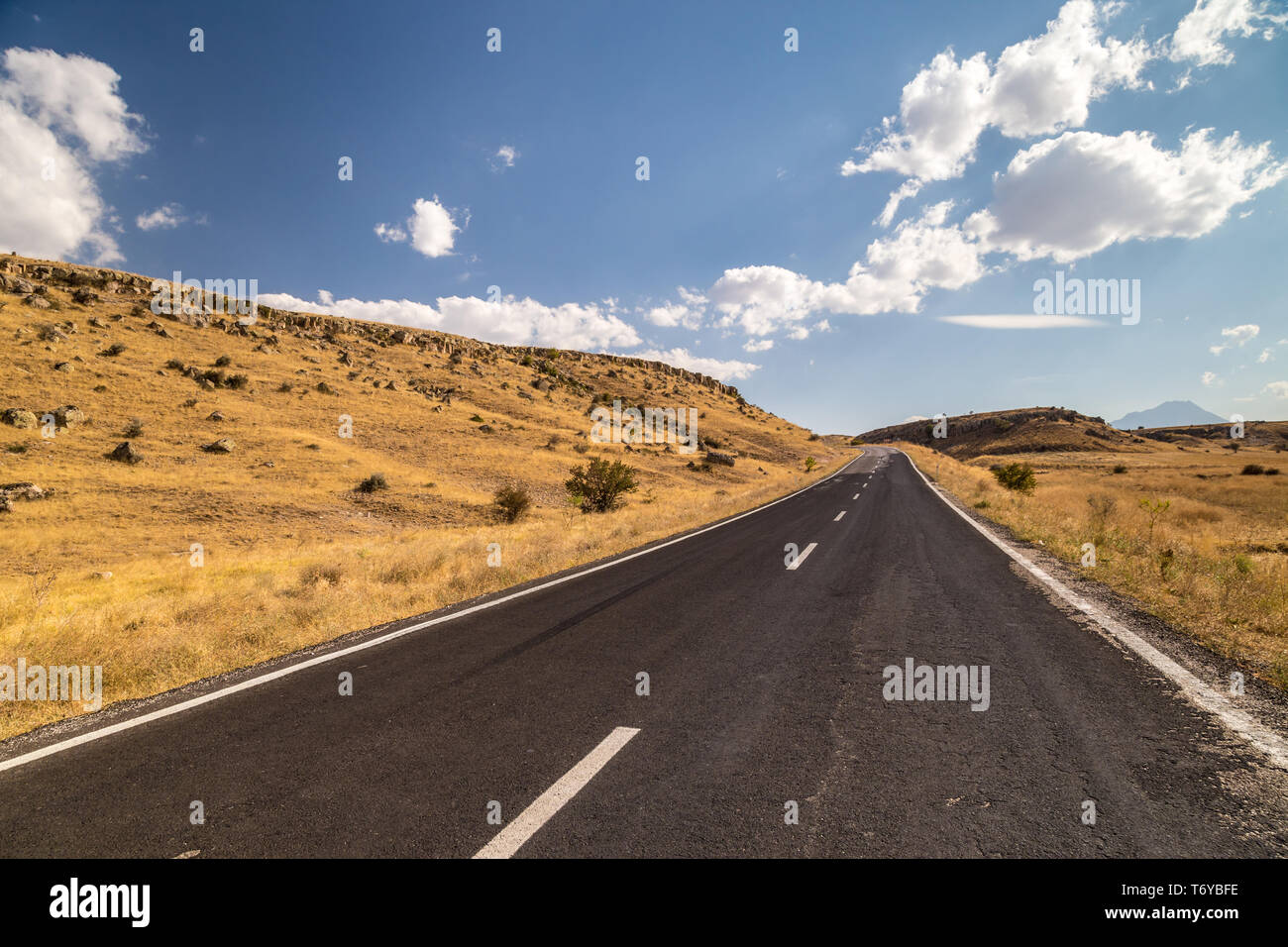 Long straight road going across countryside Stock Photo - Alamy