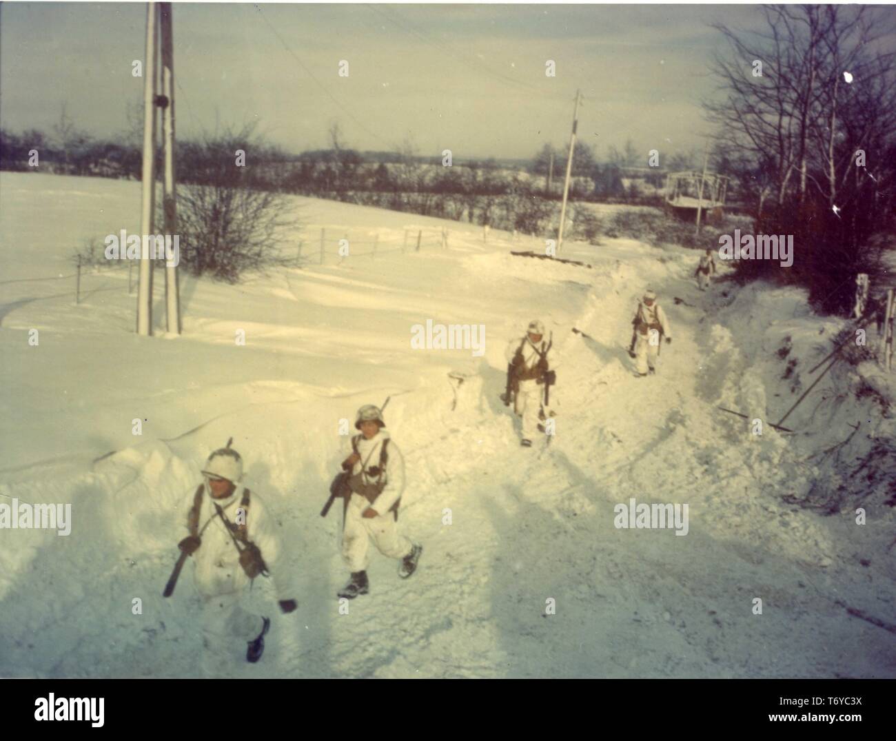 23rd Armored Battalion soldiers walking through the snow, during the ...