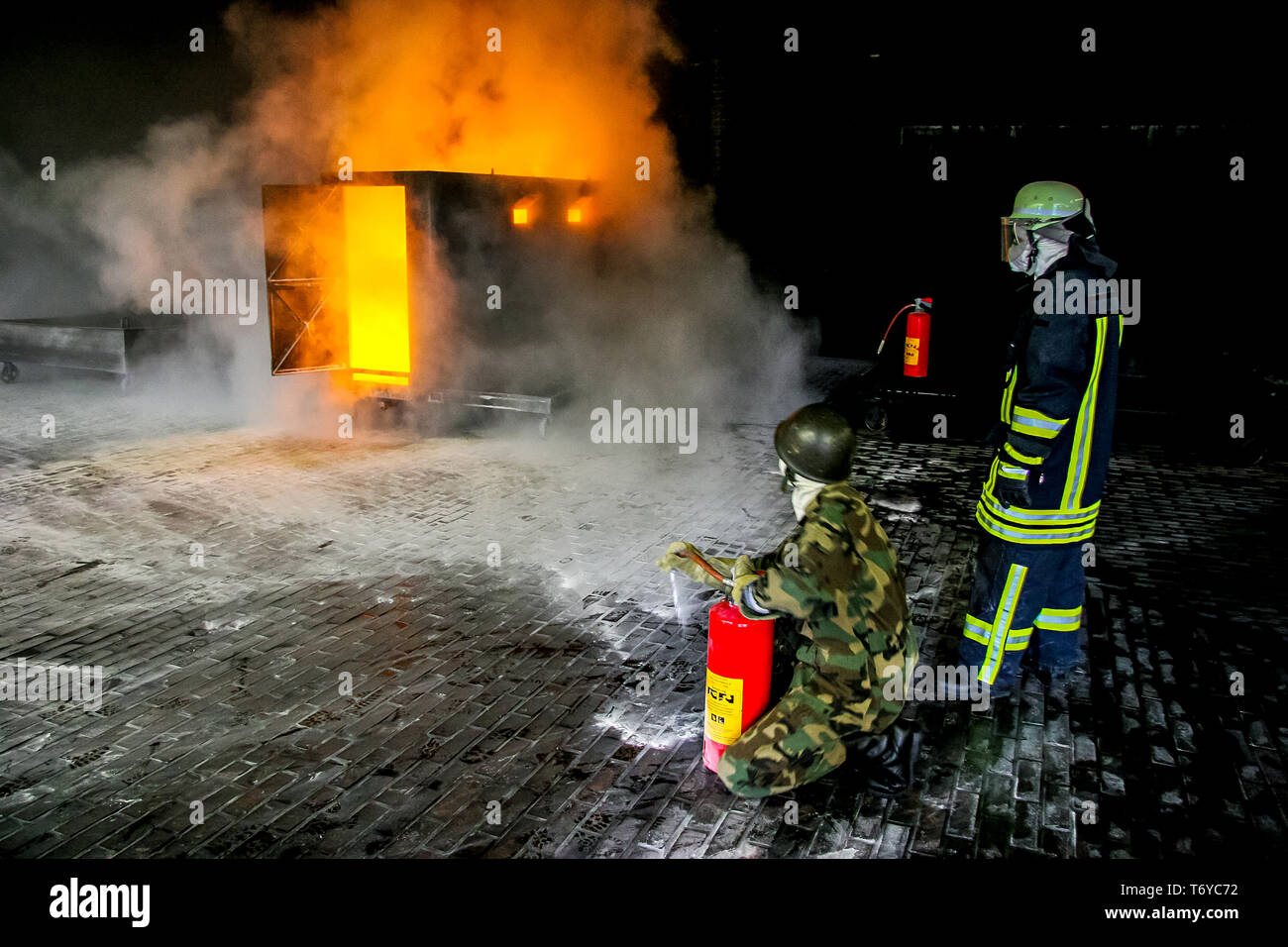 Firefighters training for fire fighting Stock Photo - Alamy
