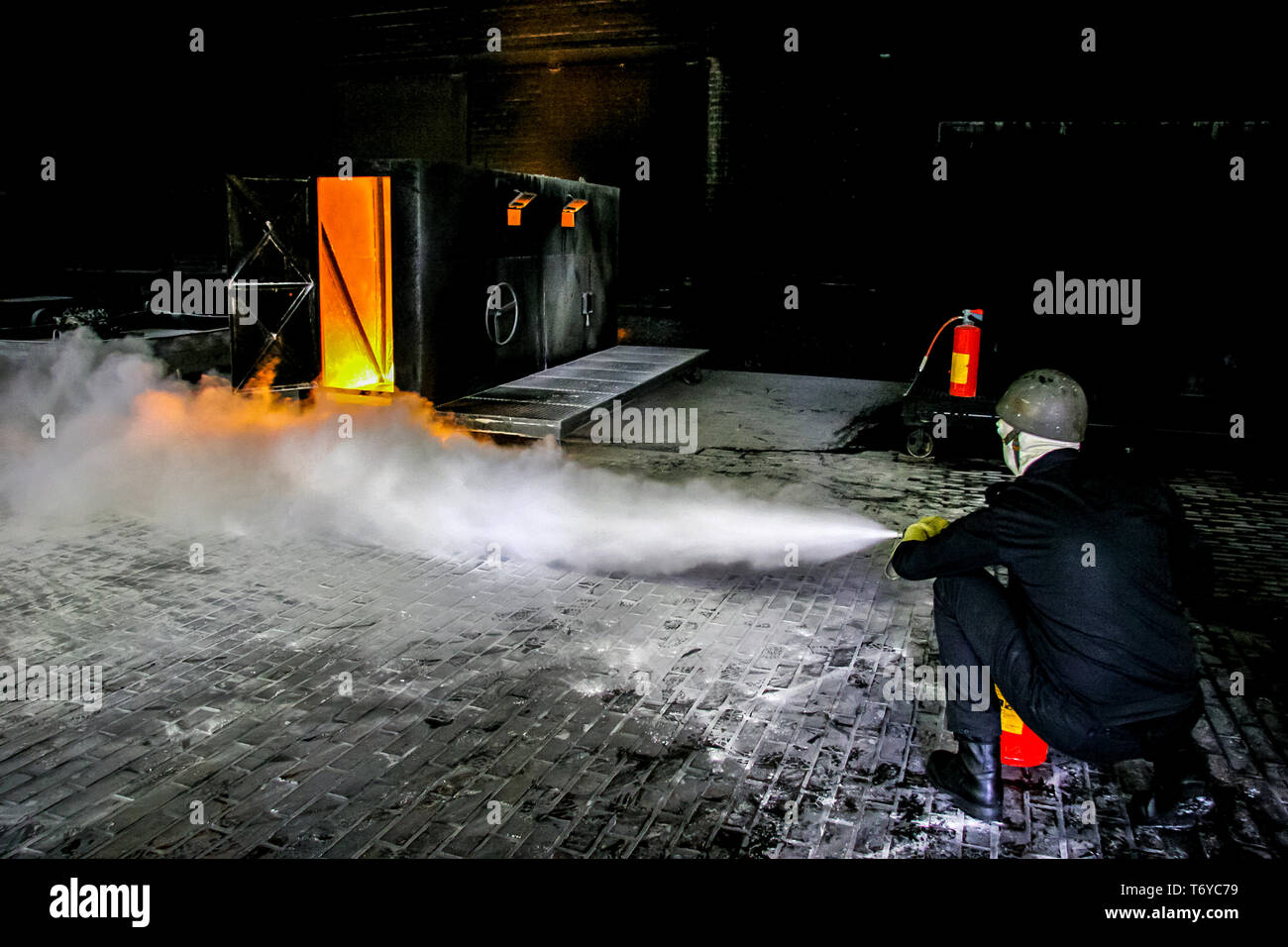 Firefighters training for fire fighting Stock Photo - Alamy