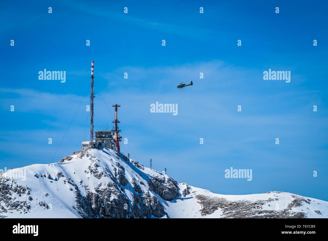 Helicopter flying the Stirovnik peak Stock Photo - Alamy