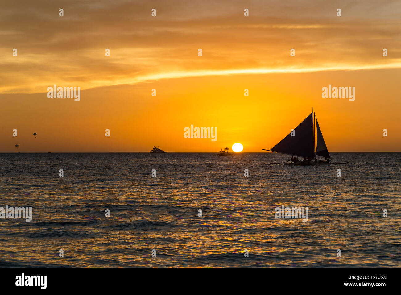 Small sailing boats at the sunset. Boracay, Philippines Stock Photo - Alamy