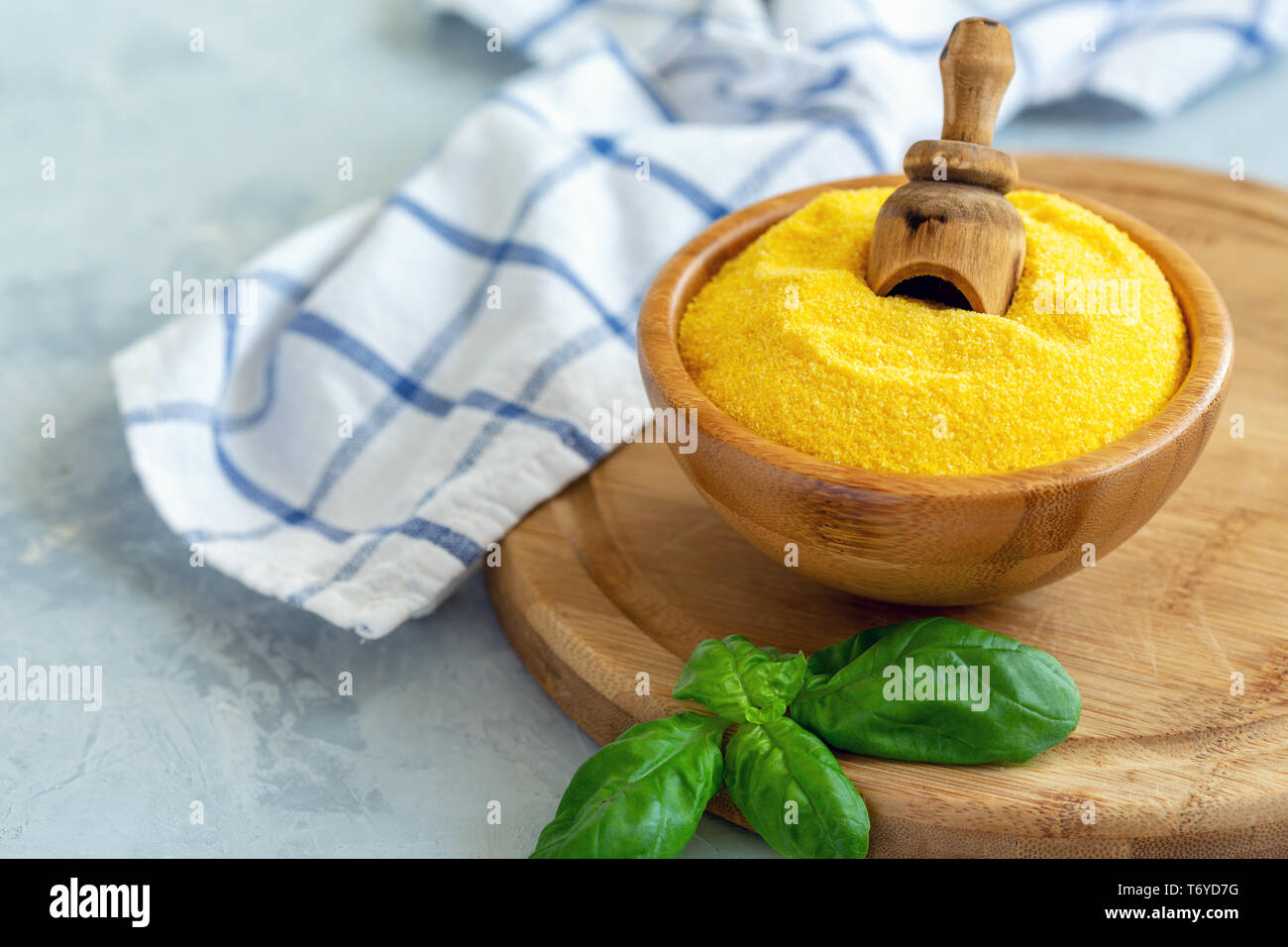 Italian polenta in a bowl and green basil Stock Photo - Alamy