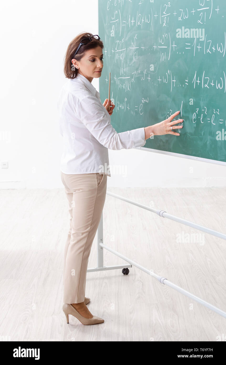 Teacher explaining formula chalkboard hi-res stock photography and ...