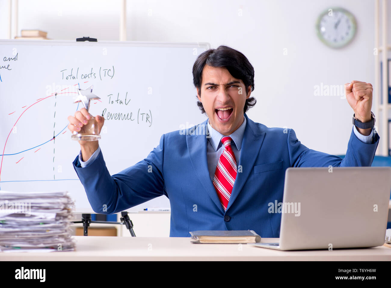 Busy businessman explaining business charts Stock Photo - Alamy