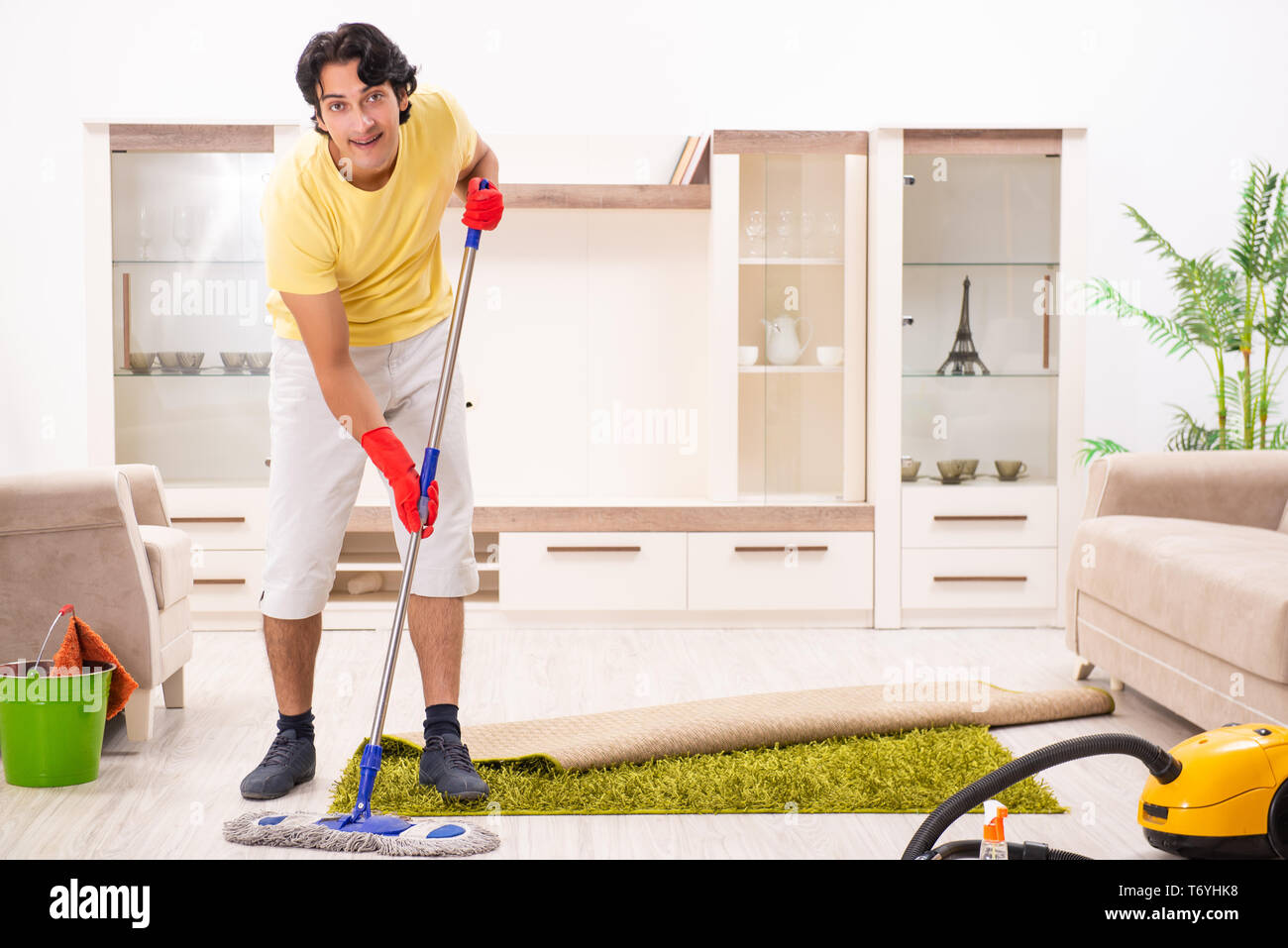 Young handsome man doing housework Stock Photo - Alamy