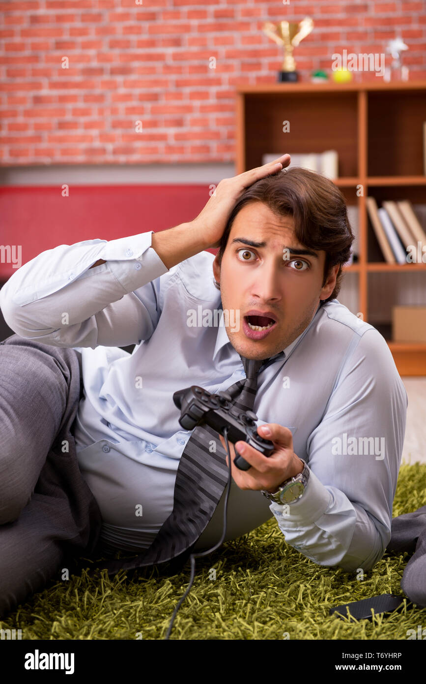 Young employee playing joystick hi-res stock photography and images - Alamy