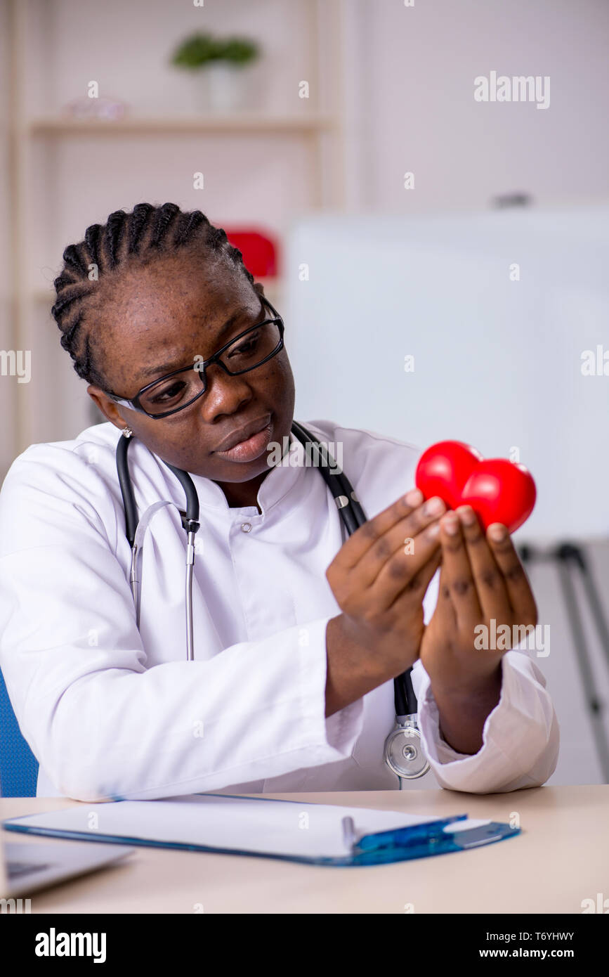 Black female doctor working at clinic Stock Photo - Alamy