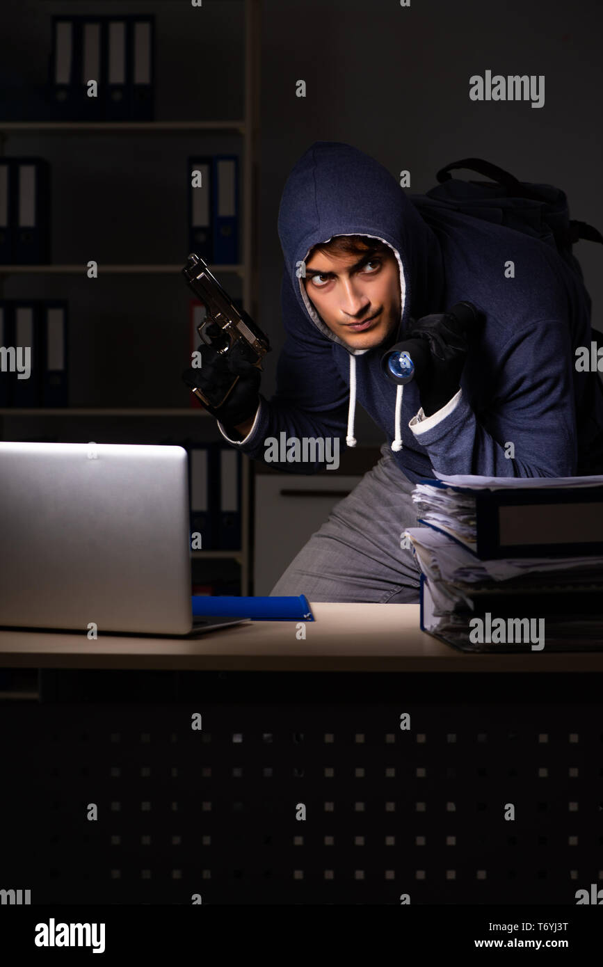 Thief trying to steal personal data in identity theft concept Stock ...