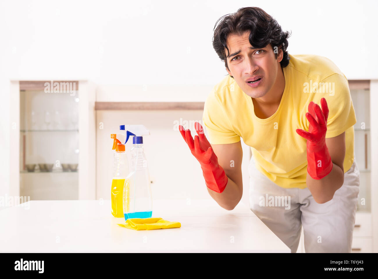 Young handsome man doing housework Stock Photo - Alamy