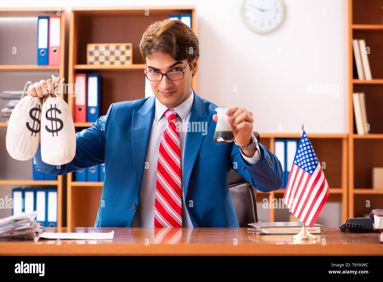 Young handsome politician sitting in office Stock Photo - Alamy