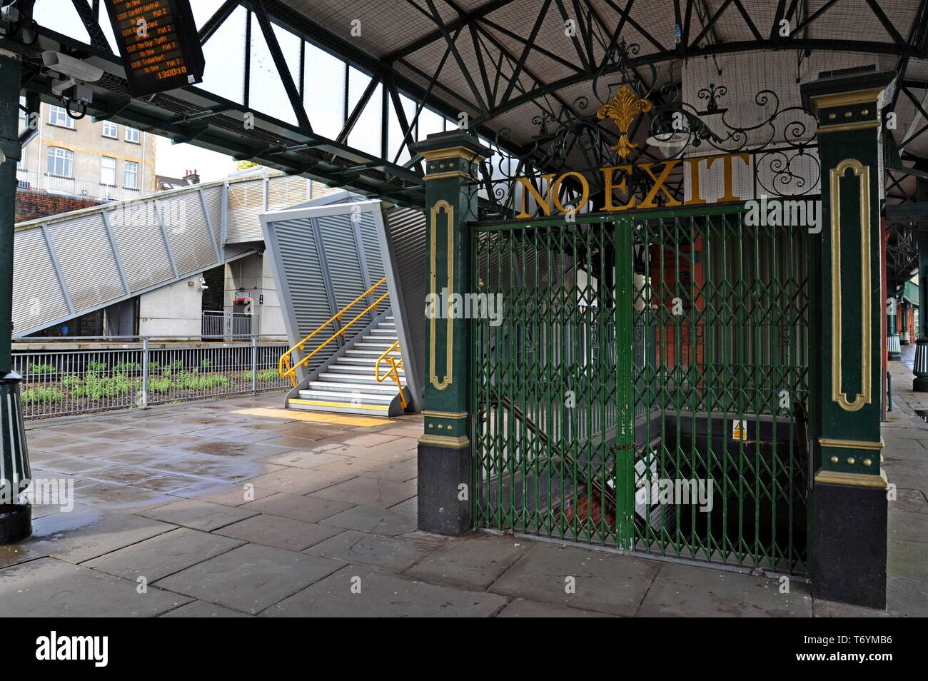 Ornate cast iron exit sign and ugley new footbridge contrast at ...