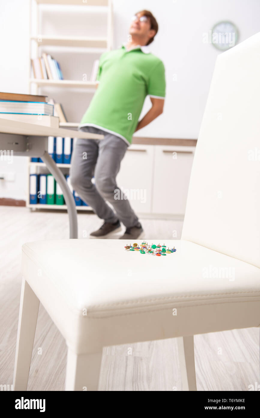 Office prank with sharp thumbtacks on chair Stock Photo - Alamy