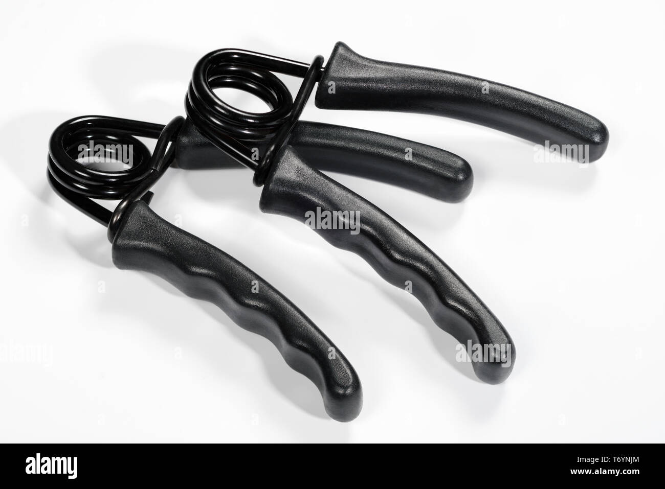 Finger hand gripper muscle trainer Stock Photo - Alamy
