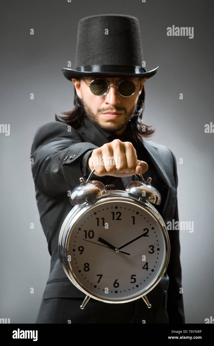 Vintage concept with man wearing black top hat Stock Photo - Alamy