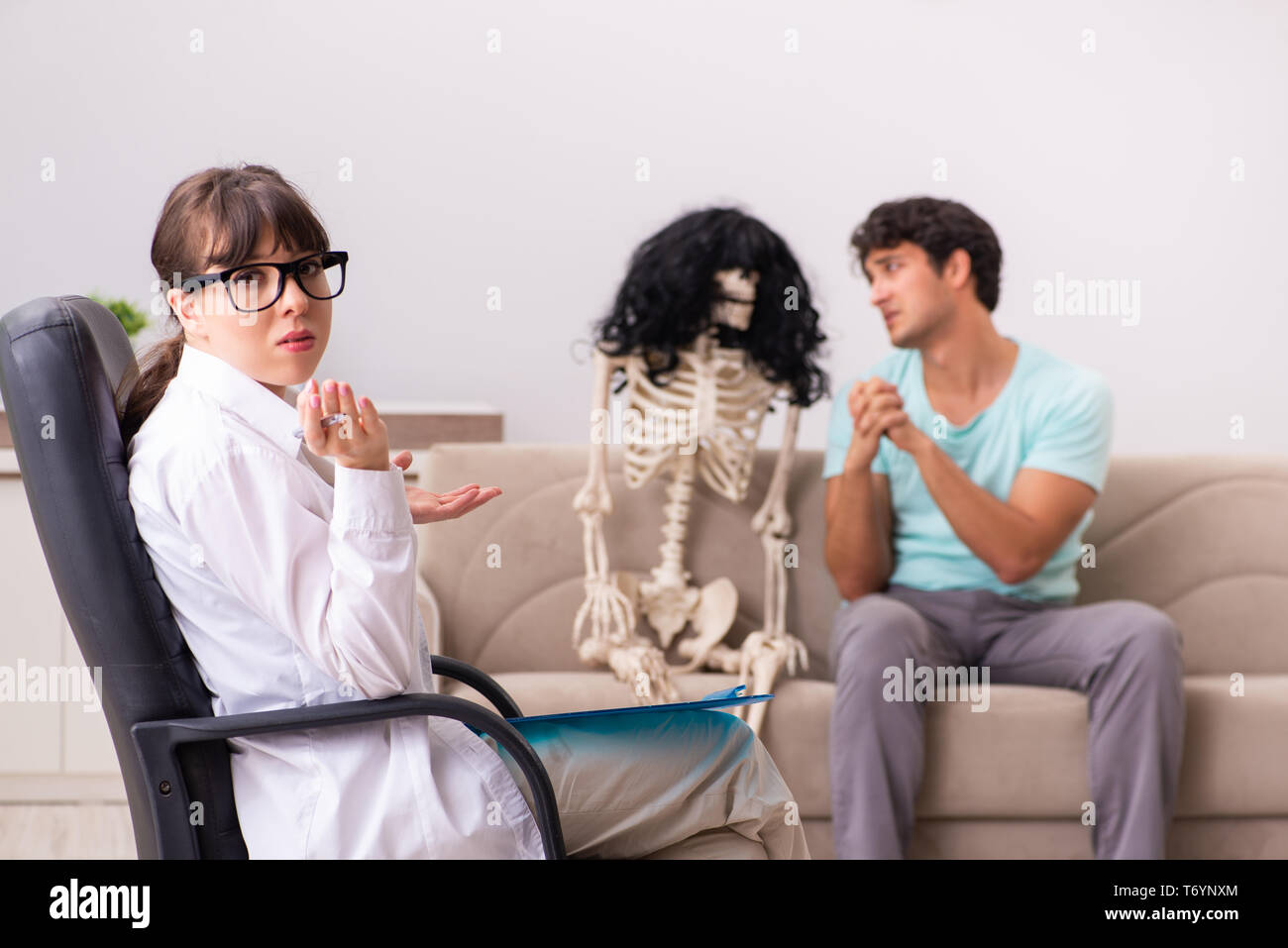Young patient visiting psychologist for therapy Stock Photo - Alamy