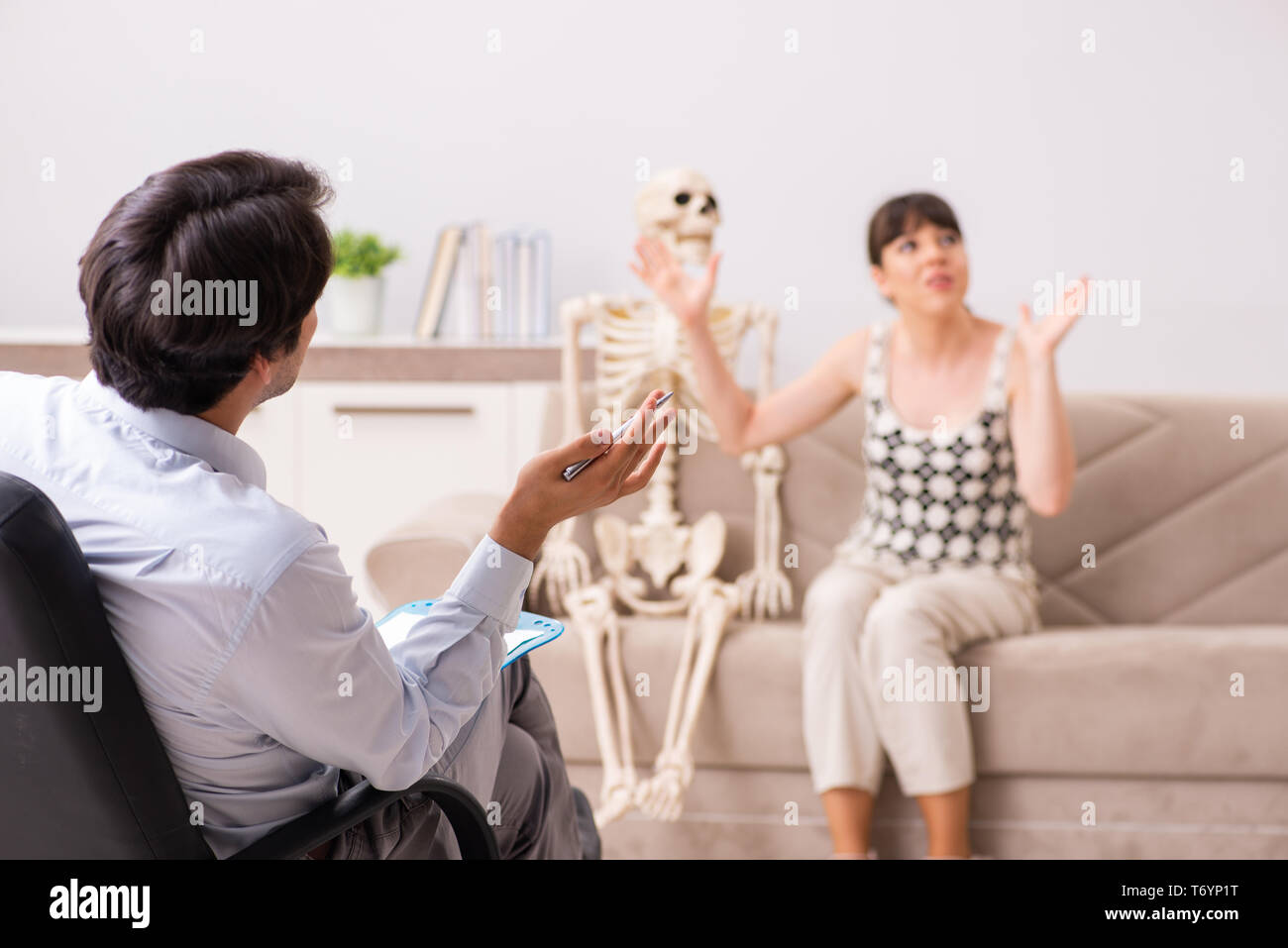 Young patient visiting psychologist for therapy Stock Photo - Alamy