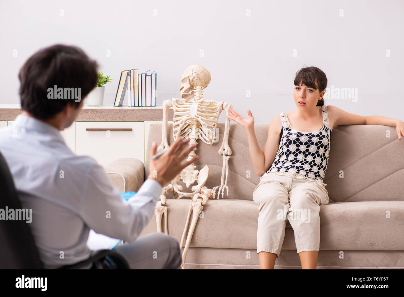 Young patient visiting psychologist for therapy Stock Photo - Alamy