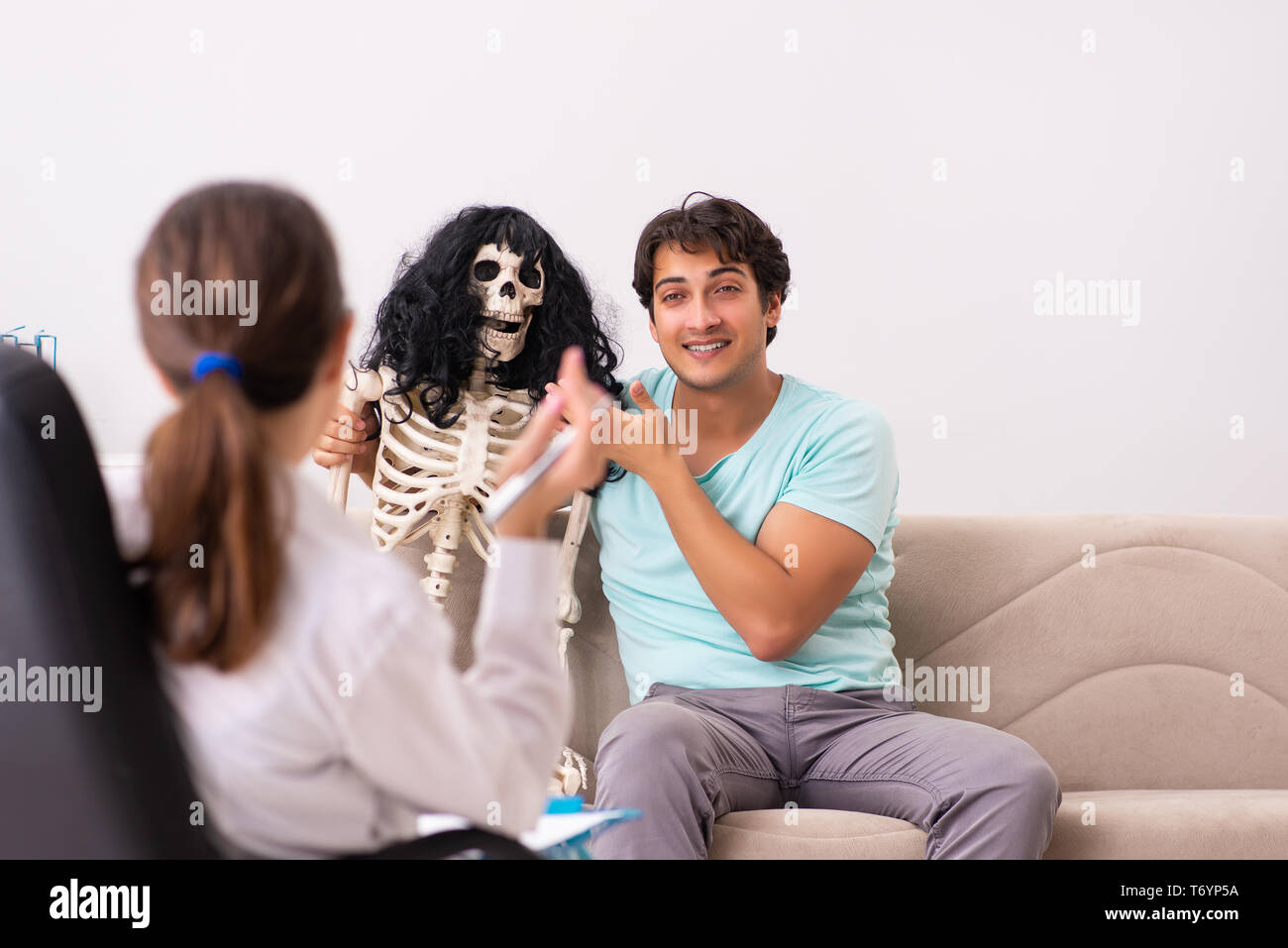 Young patient visiting psychologist for therapy Stock Photo - Alamy