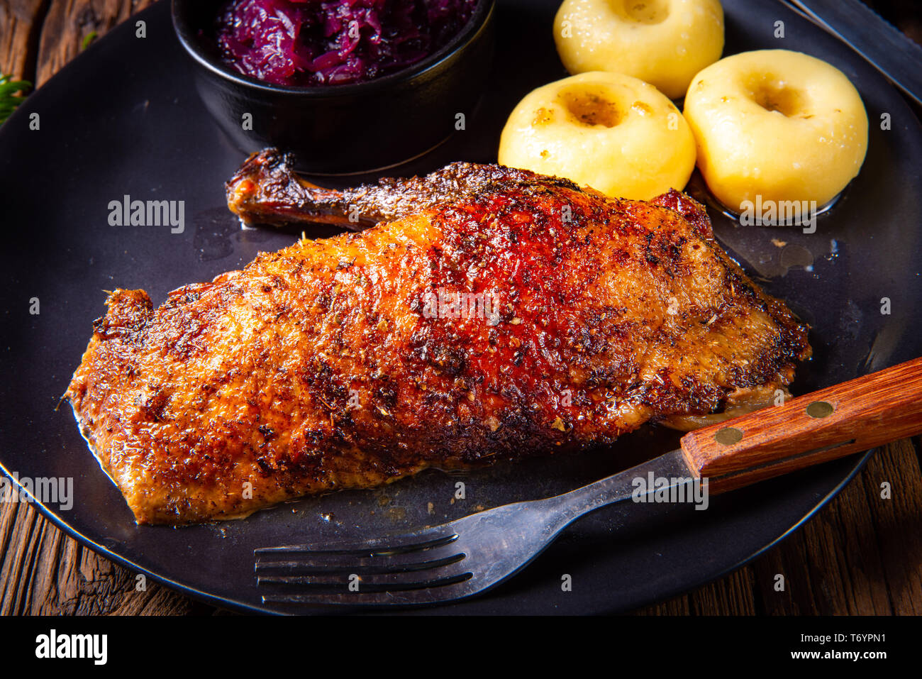 classic and crispy roasted duck with cabbage and dumplings Stock Photo ...