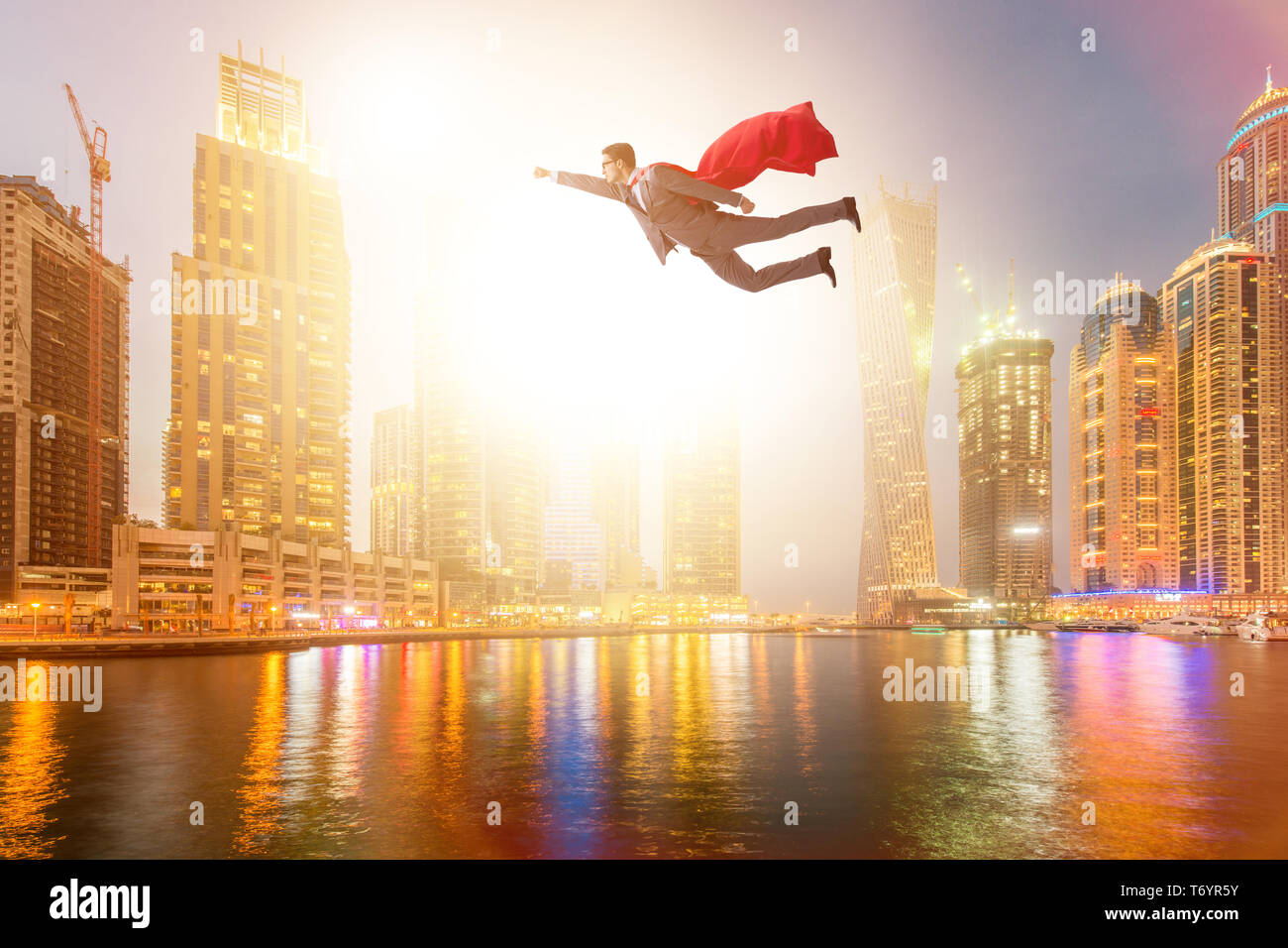 Superhero businessman flying over the city Stock Photo - Alamy